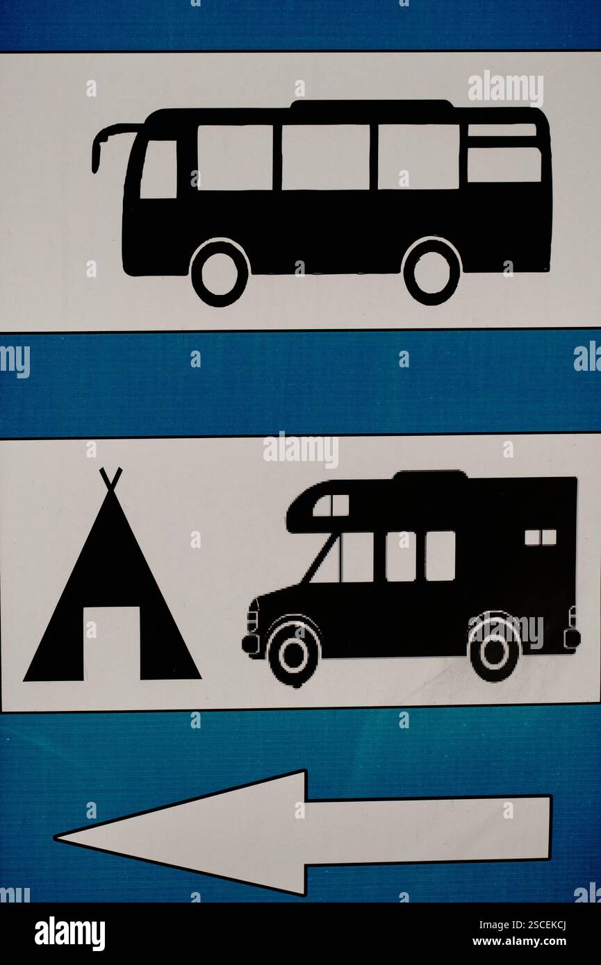 A blue road sign with an arrow indicating the parking place of tourist ...