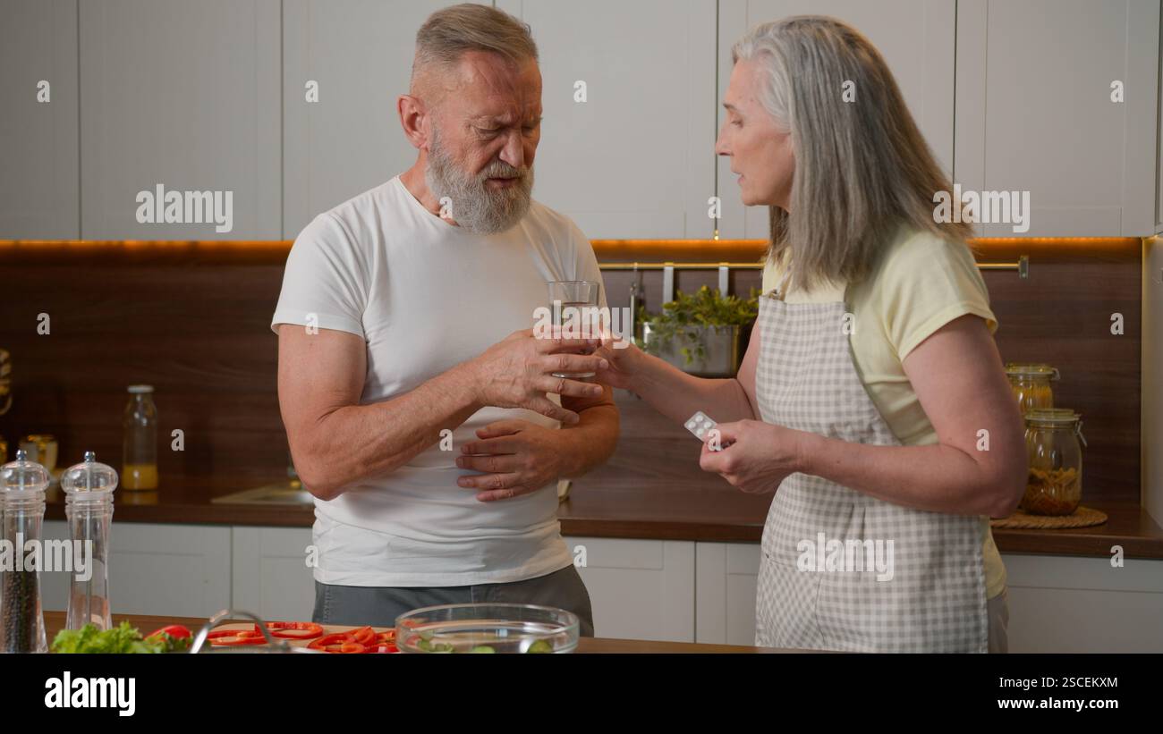 Sick unhealthy old man in kitchen feeling pain in chest heart attack ...