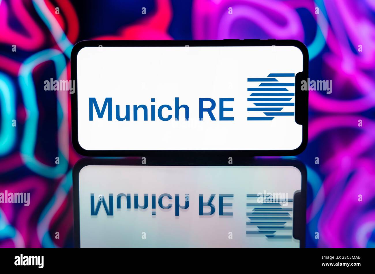 In this photo illustration, the Munich RE logo is seen displayed on a ...