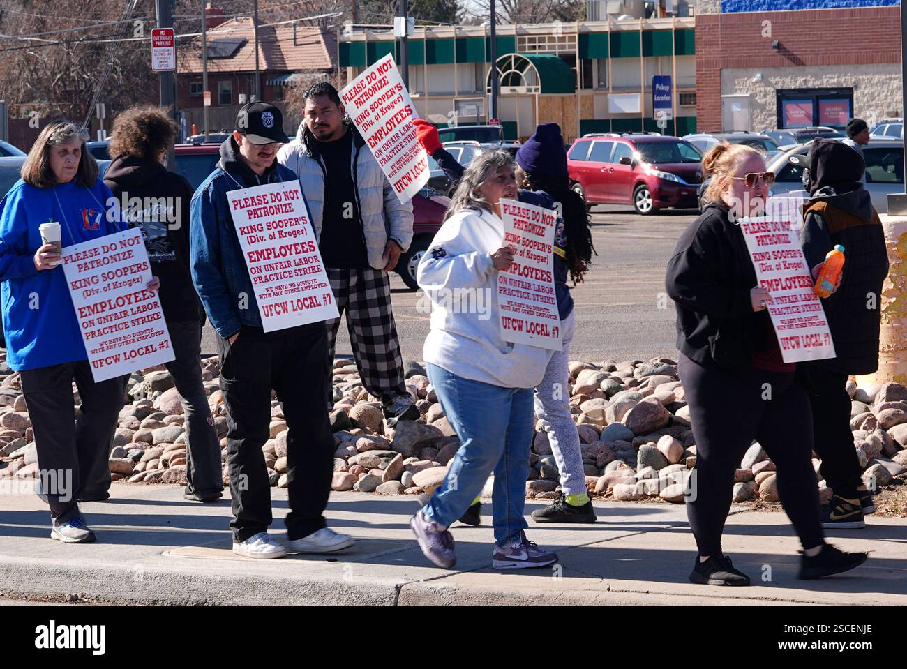 Workers walk a picket line outside a King Soopers grocery store as a ...