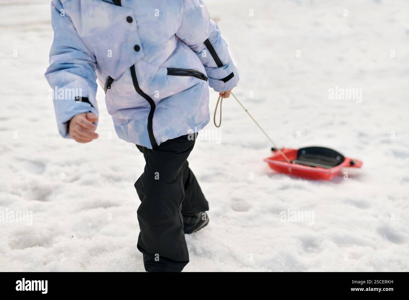 Boy girl sledding down snow hi-res stock photography and images - Alamy