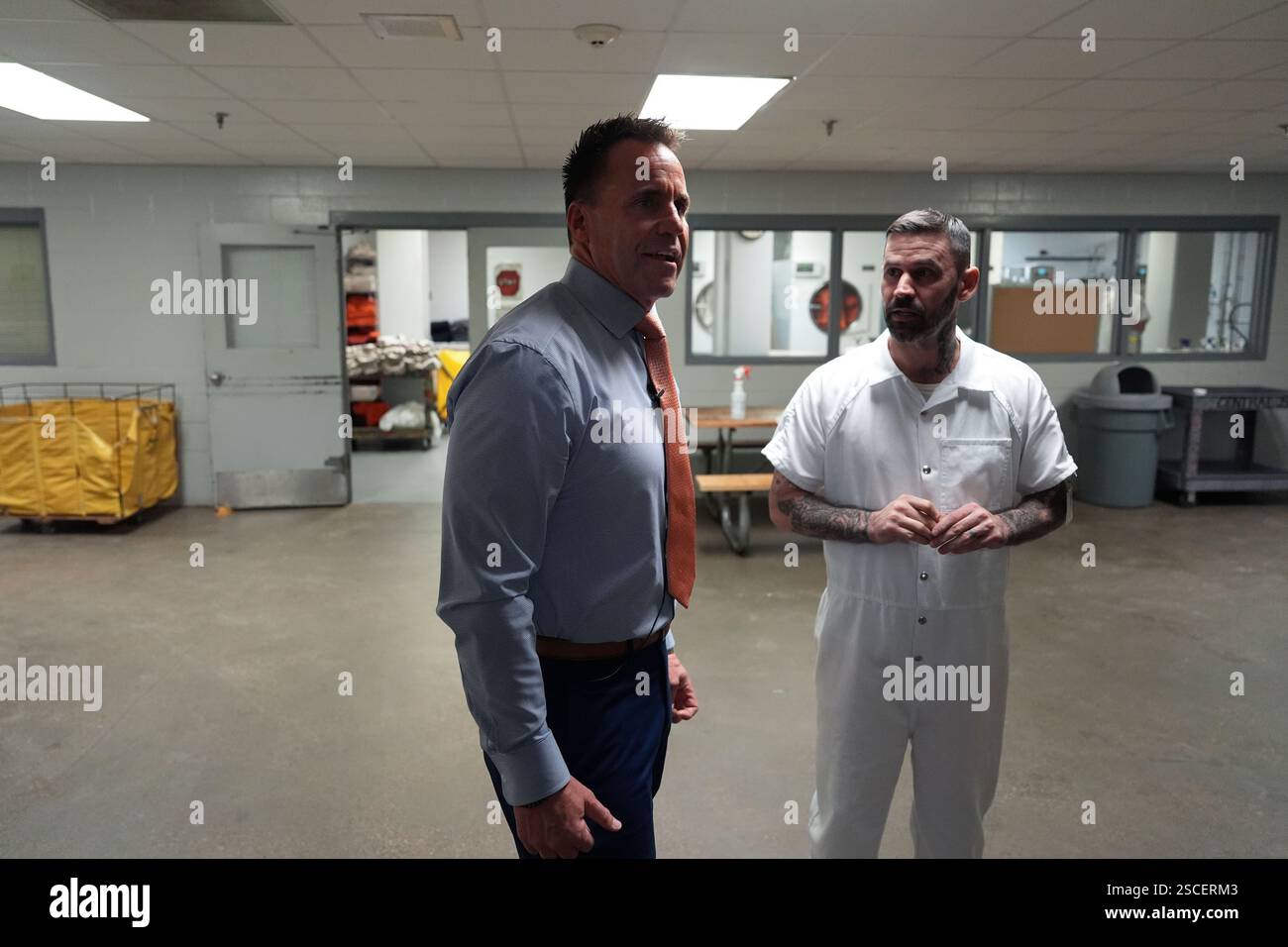 Genesee County Sheriff Chris Swanson talks with an inmate at the county ...