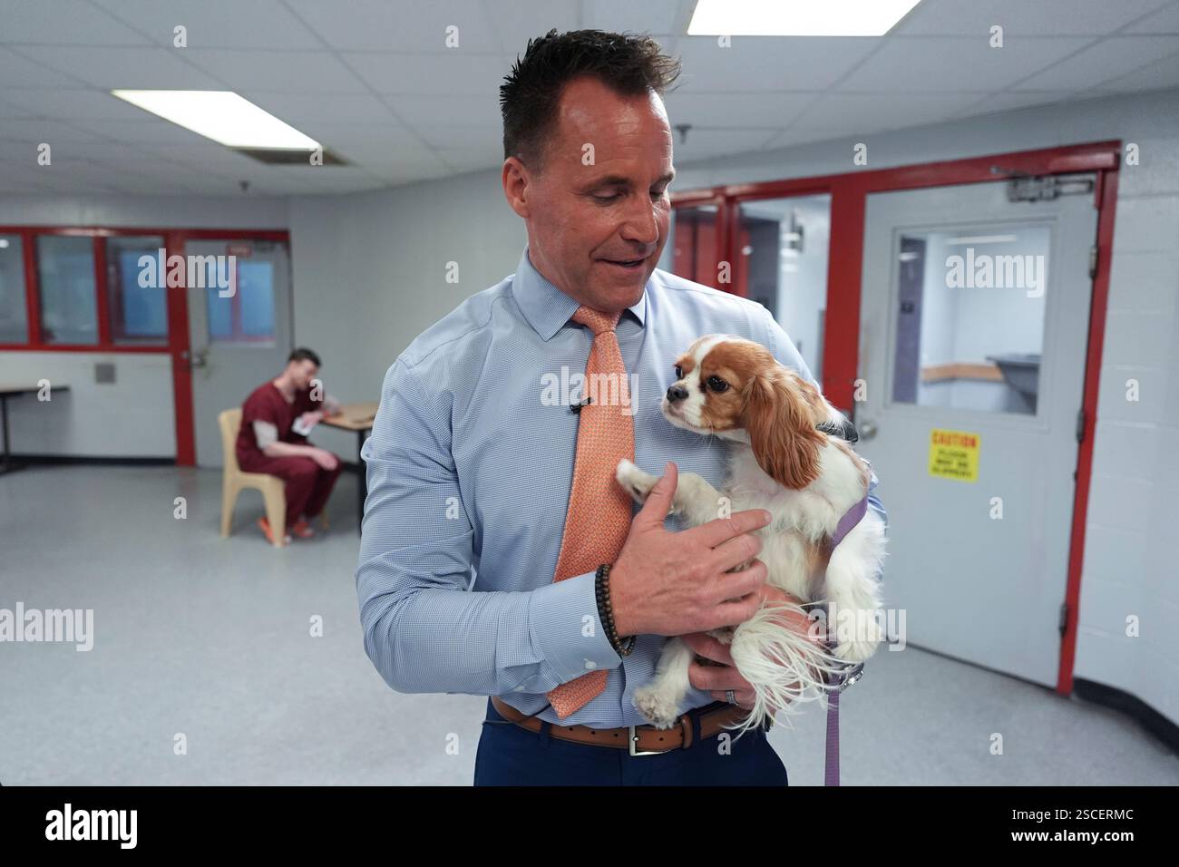 Genesee County Sheriff Chris Swanson holds Josie, an emotional support ...