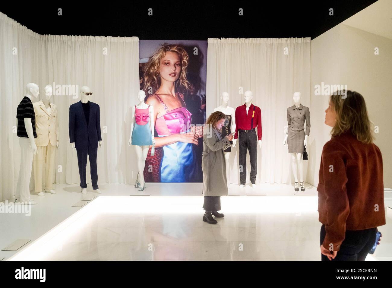 People are seen visiting the creations of Italian fashion designer ...