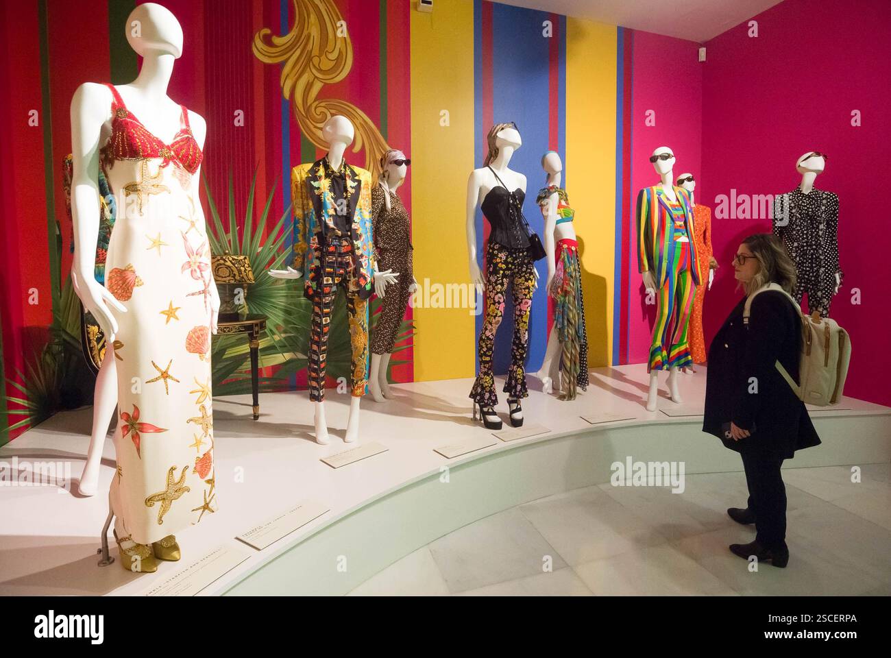A woman is seen looking at the creations of Italian fashion designer ...