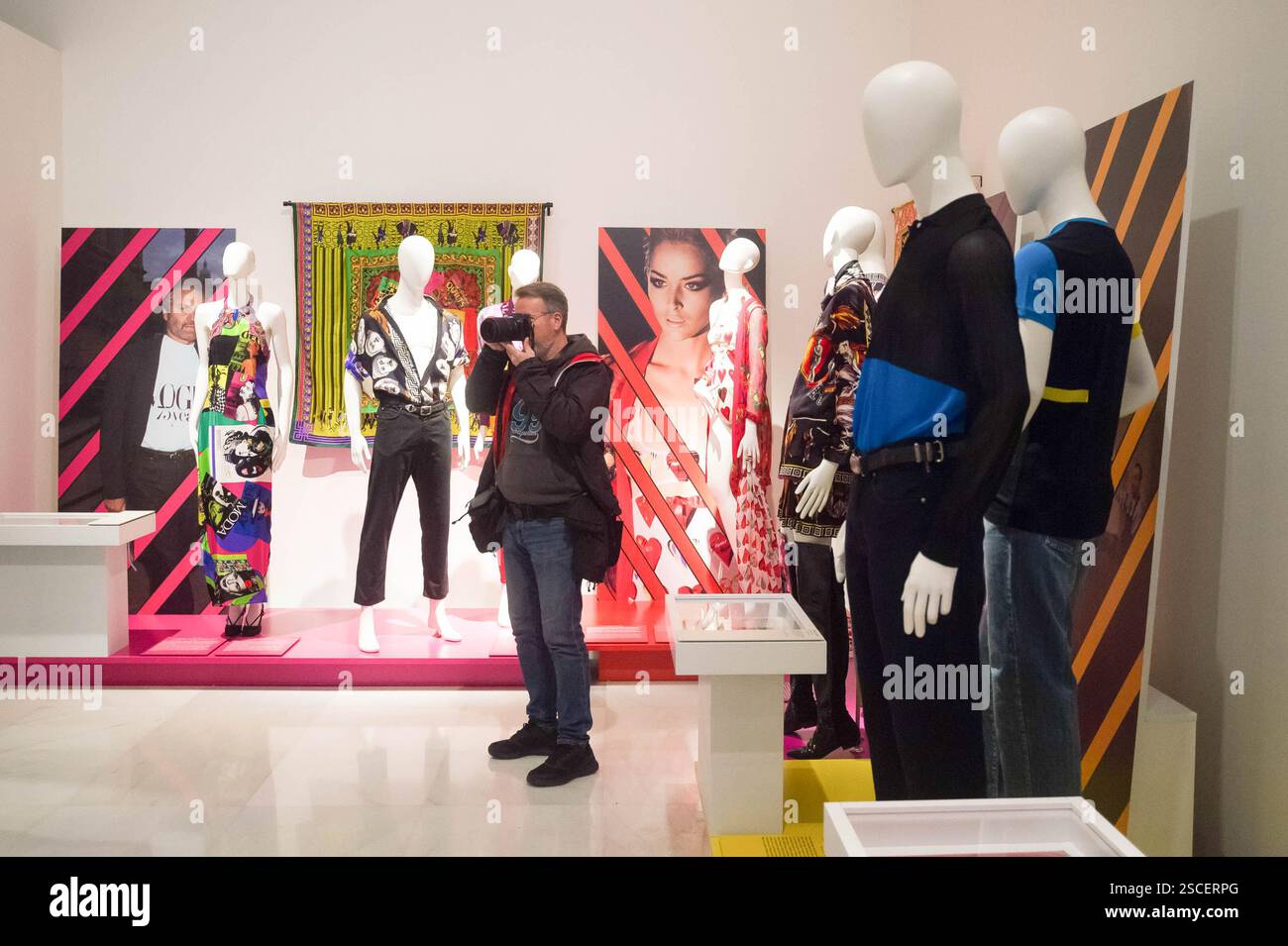 A man is seen taking photos of the creations of Italian fashion ...