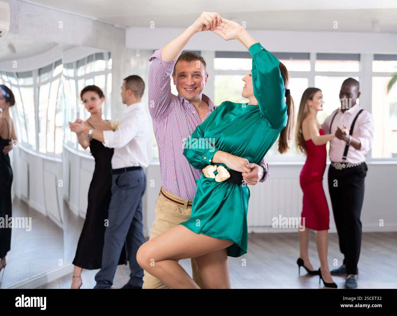 Man and woman dancing waltz in couple during lesson at studio Stock ...