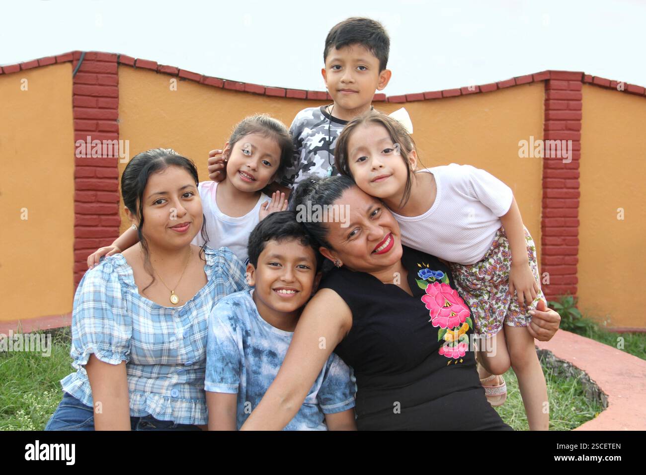 Brown Latino mom and children spend quality time together show their ...
