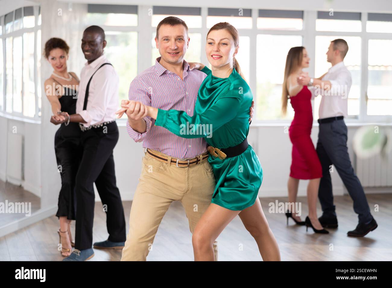 Man and woman dancing waltz in couple during lesson at studio Stock ...