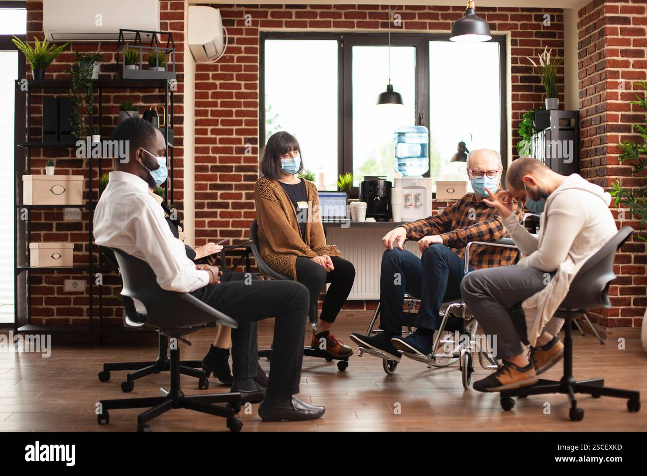 People in masks formed therapy circle, with psychiatrist leading ...