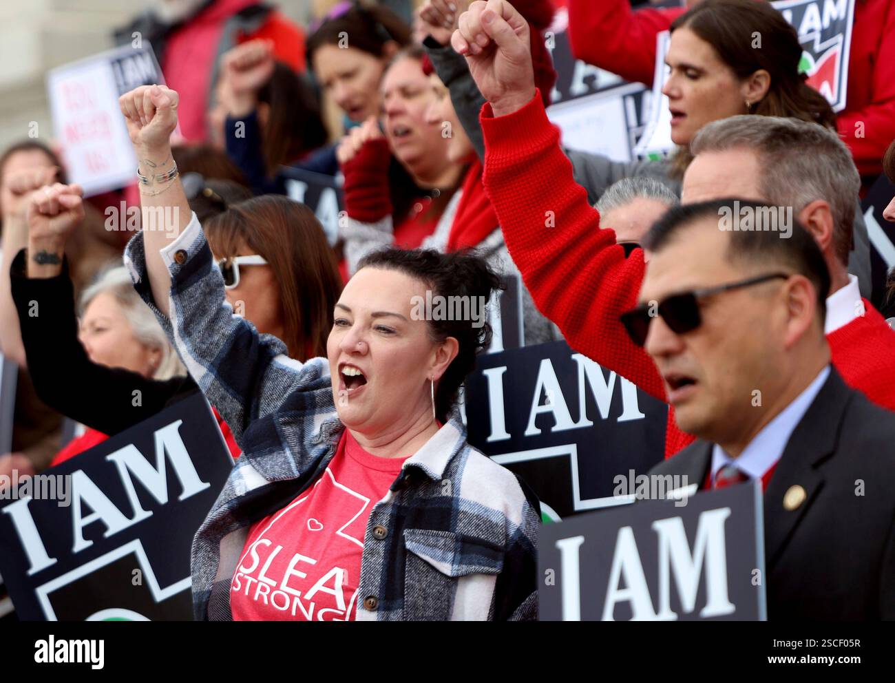 Chelsie Acosta, Salt Lake Education Association Vice President, cheers ...