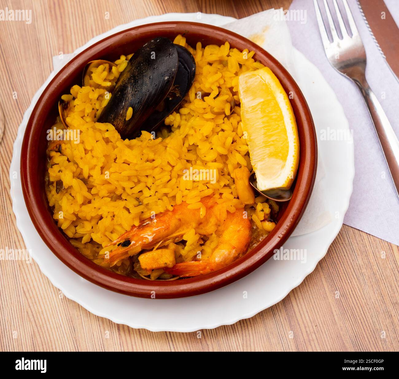 National dish of Spanish cuisine is Paella with seafood Stock Photo - Alamy