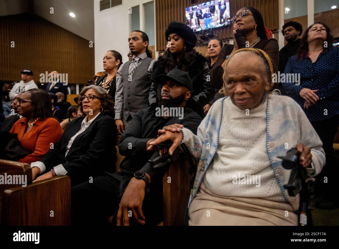 Pasadena, California, USA. 6th Feb, 2025. Zaire Calvin holds his mother ...