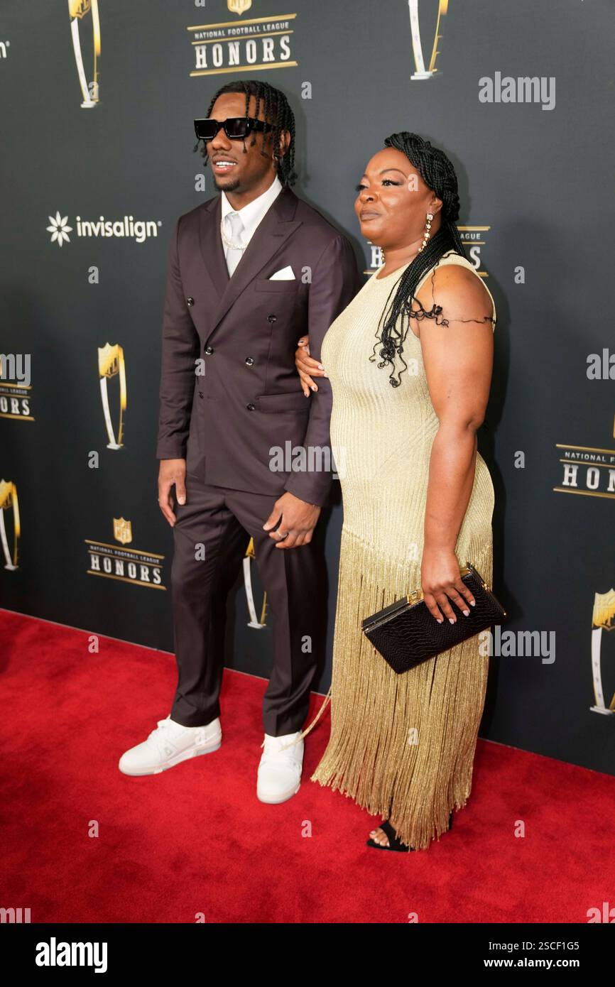 New York Giants' Malik Nabers, left, poses on the red carpet at the NFL ...