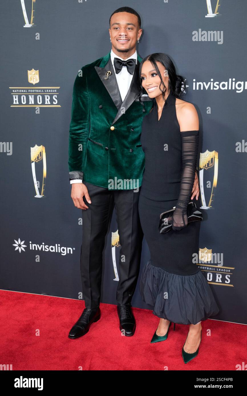Denver Broncos' Patrick Surtane II and wife Michelle pose on the red ...
