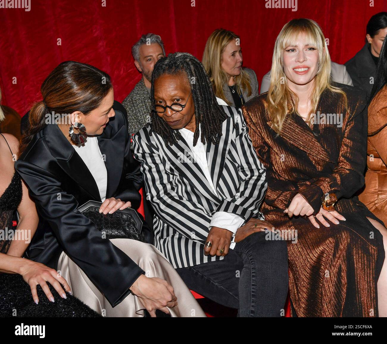 Katie Holmes, left, Whoopi Goldberg and Natasha Bedingfield attend the ...