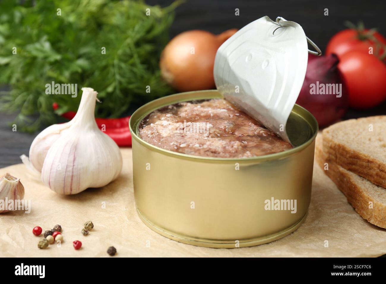 Canned meat in tin can and other products on table, closeup Stock Photo ...