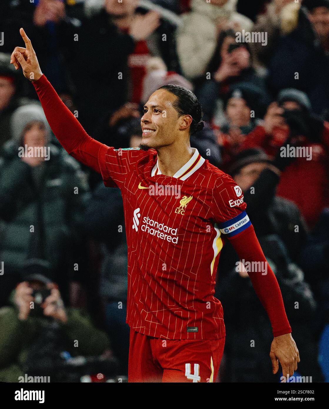 Liverpool's Virgil van Dijk celebrates after scoring their fourth goal ...