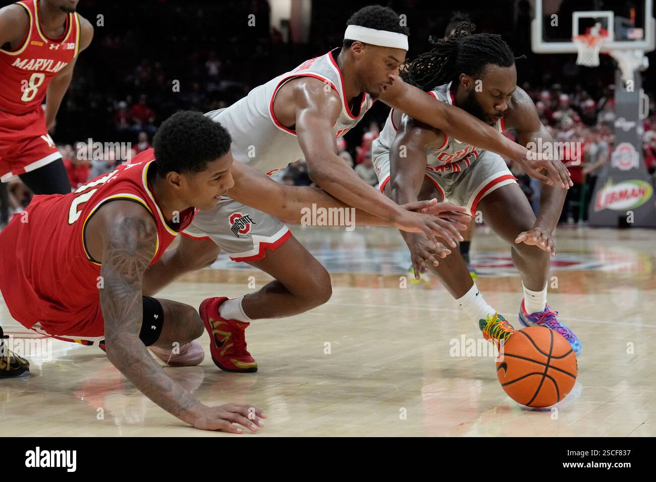 Maryland's Julian Reese, left, reaches for the ball with Ohio State's ...