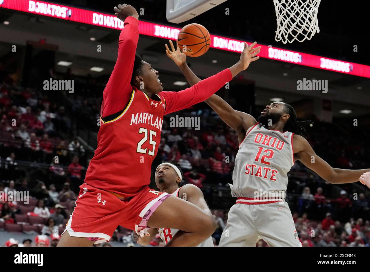 Maryland center Derik Queen (25) loses the ball in front of Ohio State ...