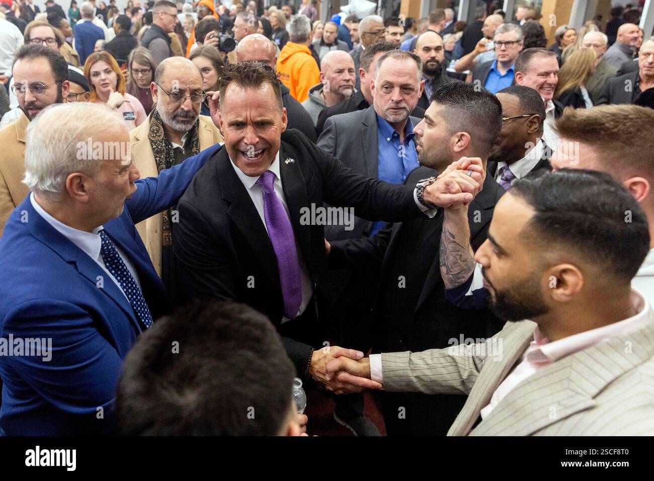 Genesee County Sheriff Chris Swanson is embraced as he announces his ...
