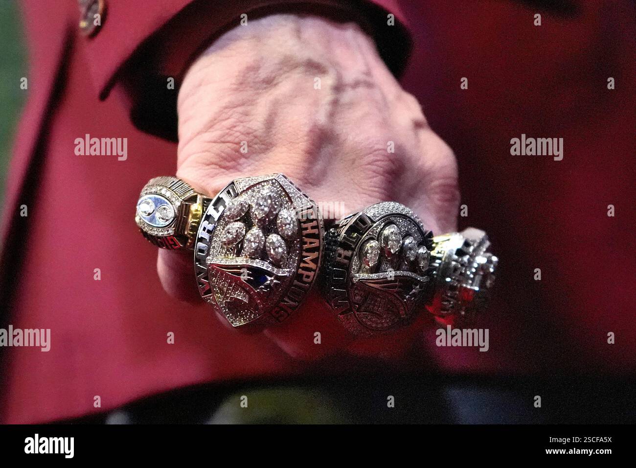 Former NFL head coach Bill Belichick shows his Super Bowl rings as he ...