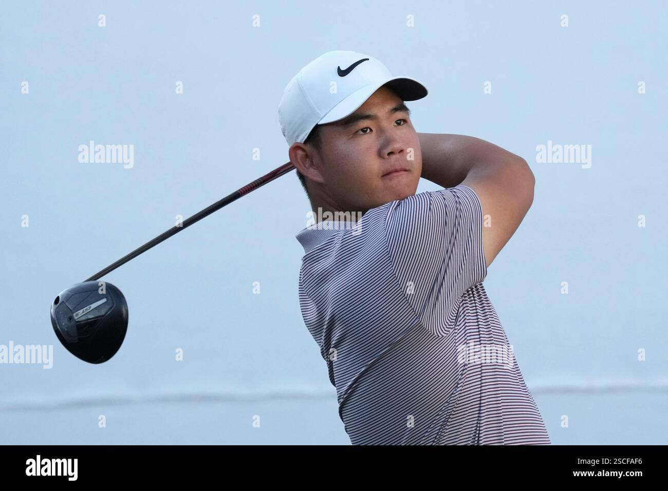 Tom Kim, of South Korea, hits his tee shot at the 17th hole during the ...