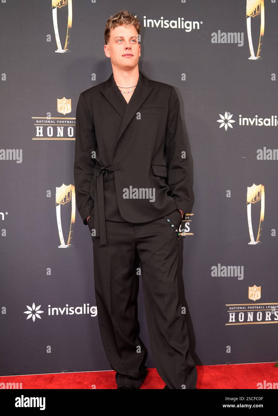 Joe Burrow, of the Cincinnati Bengals, poses on the red carpet at the ...