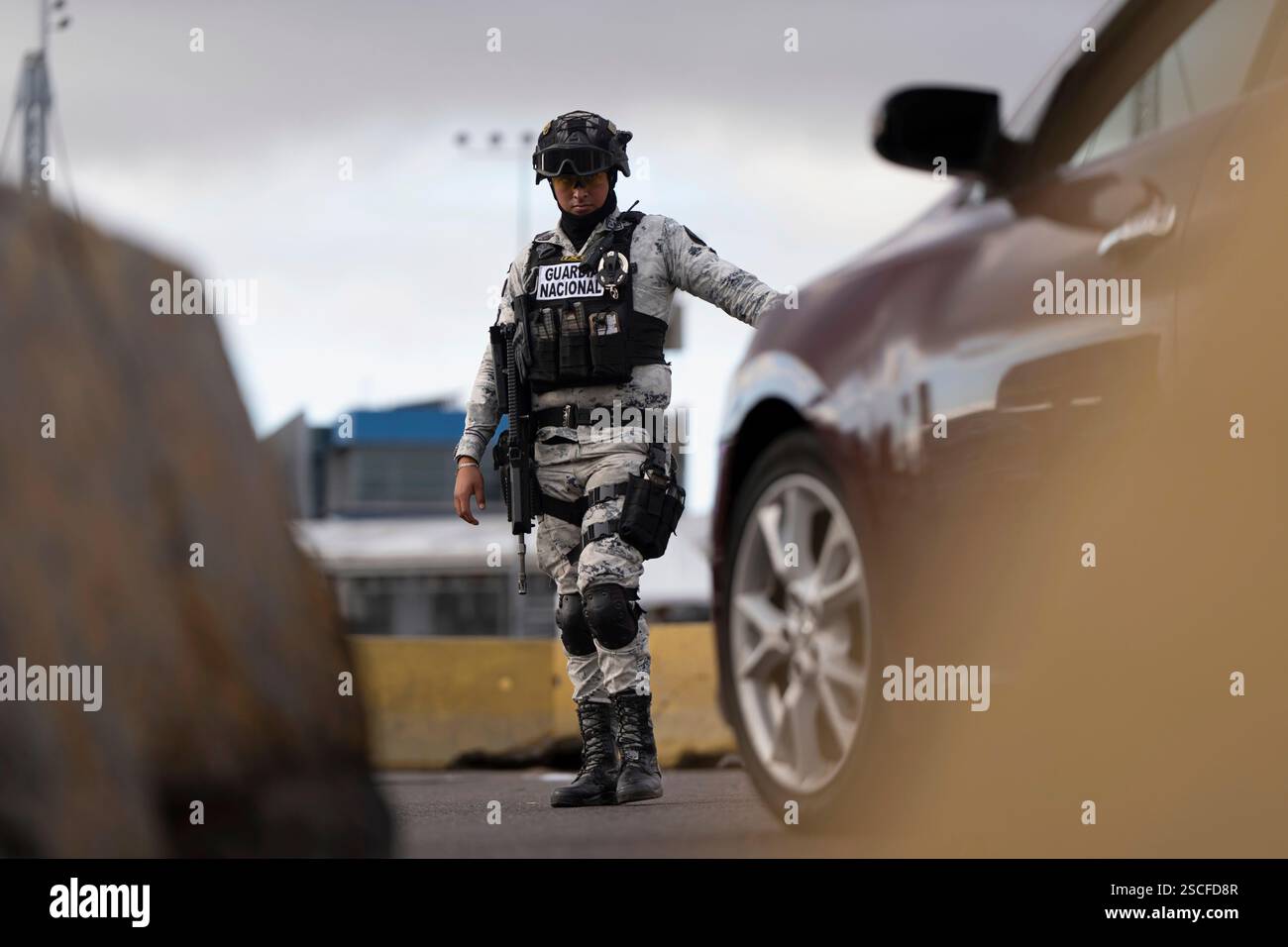 Members of Mexico's National Guard stand guard at an inspection ...