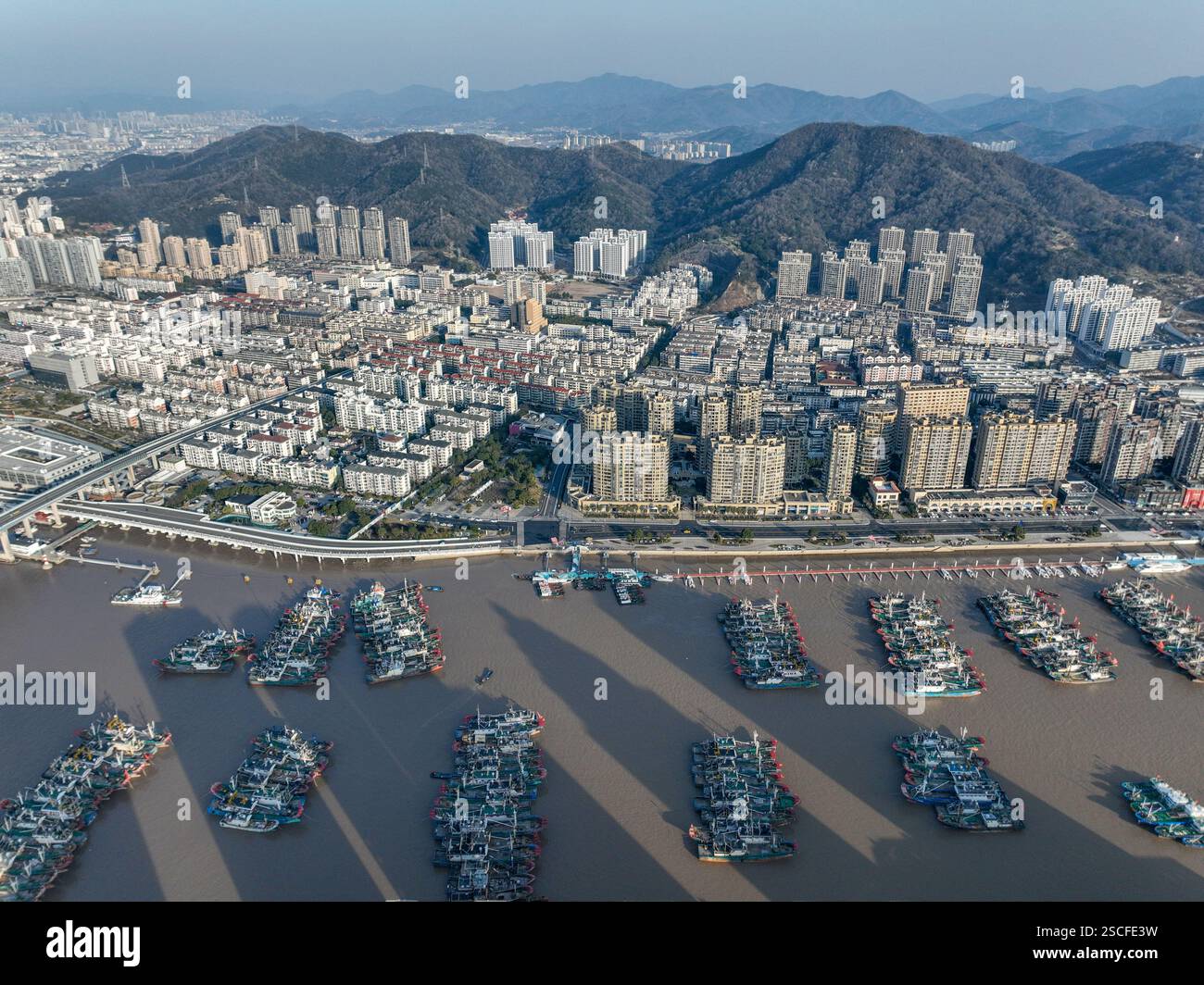 ZHOUSHAN, CHINA - FEBRUARY 7, 2025 - Fishing boats are docked at ...