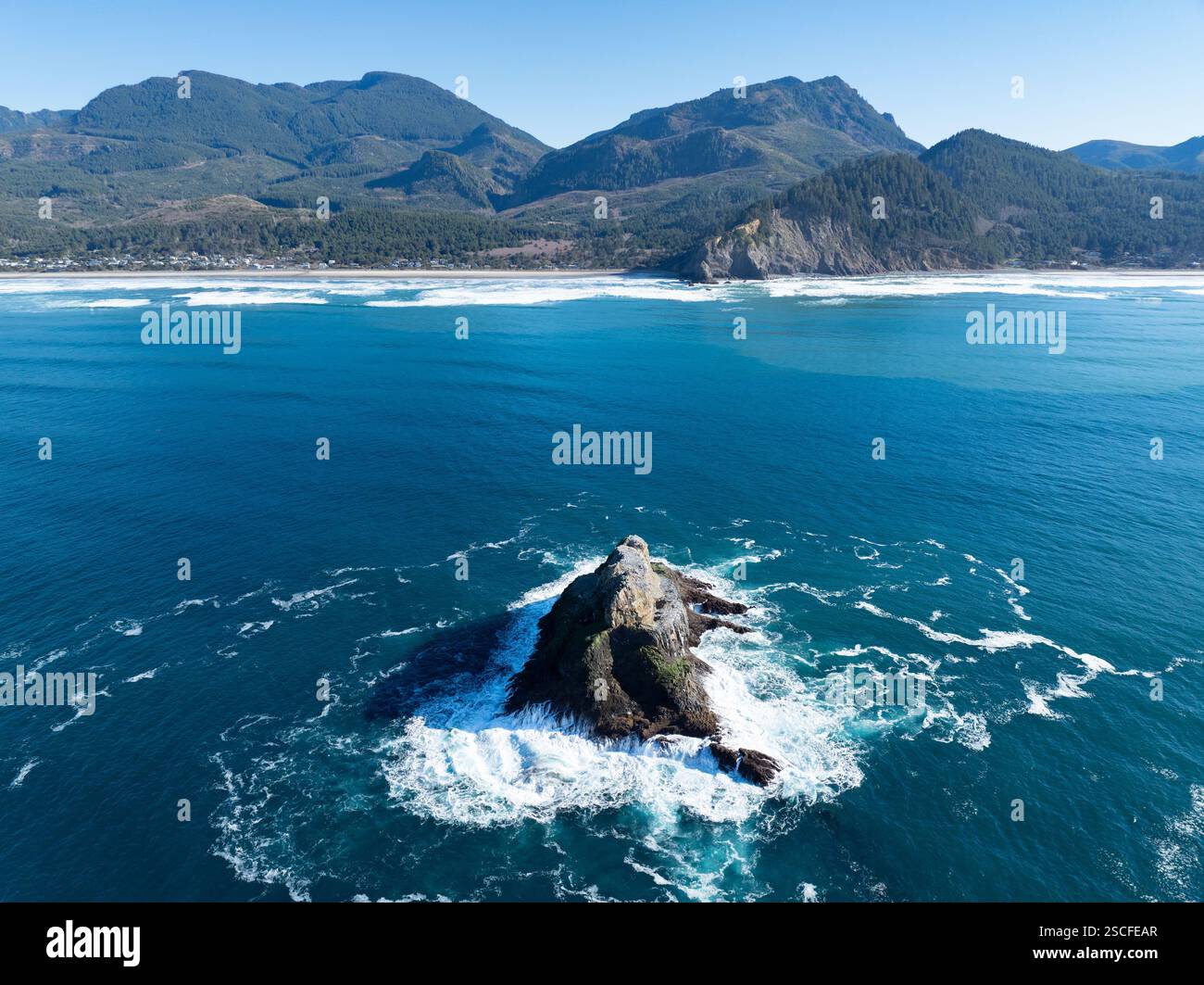 The Pacific Ocean washes against a solitary sea stack off the scenic ...