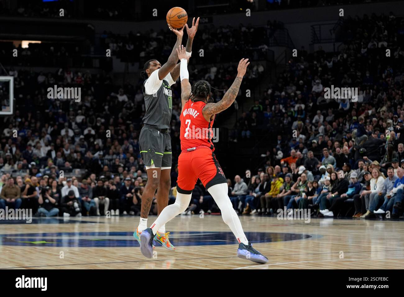Minnesota Timberwolves center Naz Reid (11) shoots over Houston Rockets ...