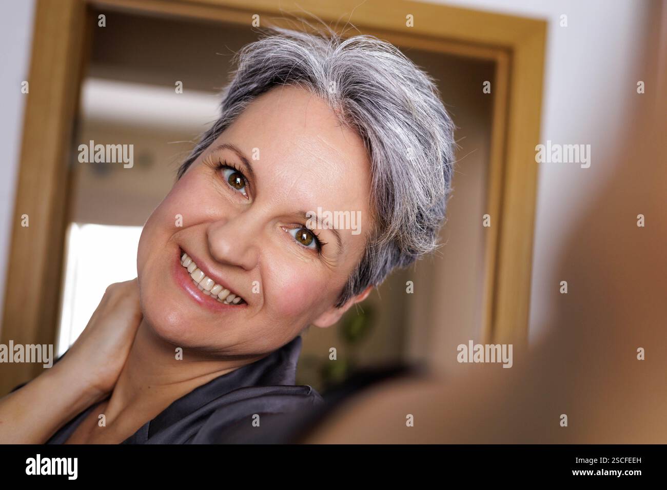 An adult well-groomed beautiful woman of age during menopause with gray ...
