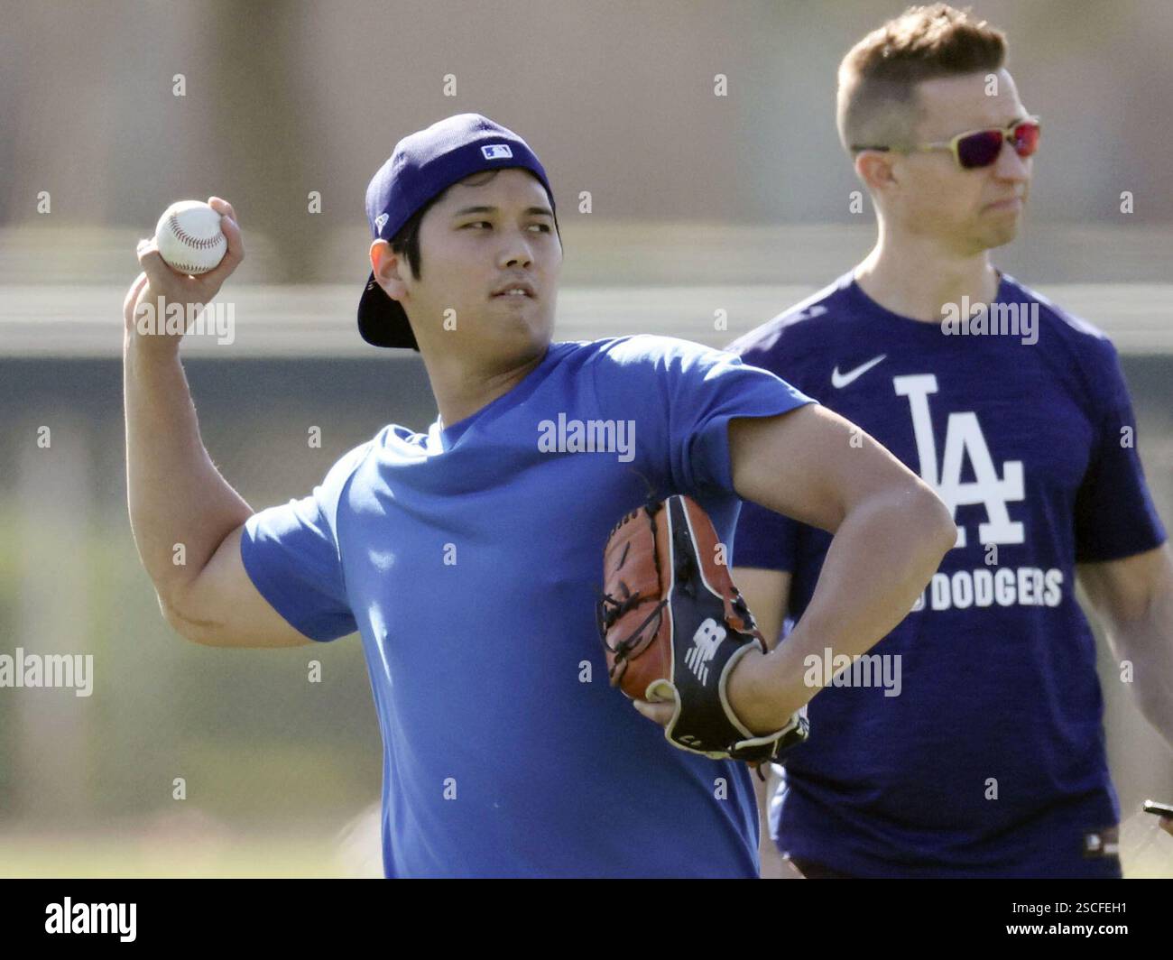 Shohei Ohtani of the Los Angeles Dodgers plays catch at the team's ...