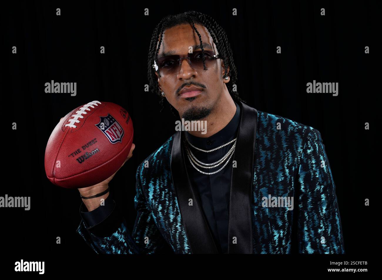 Washington Commanders' Jayden Daniels, AP NFL Offensive Rookie of the Year, poses after winning ...