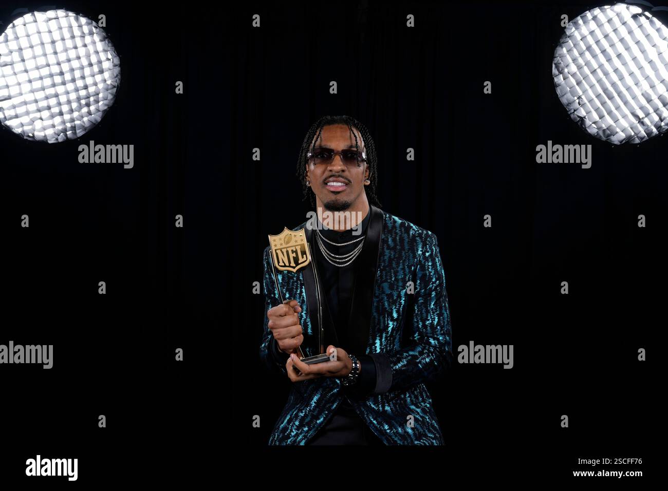 Washington Commanders' Jayden Daniels, AP NFL Offensive Rookie of the Year, poses after winning ...