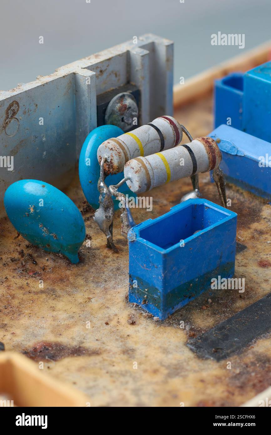 close-up of damaged or disassembled various components of circuit board ...