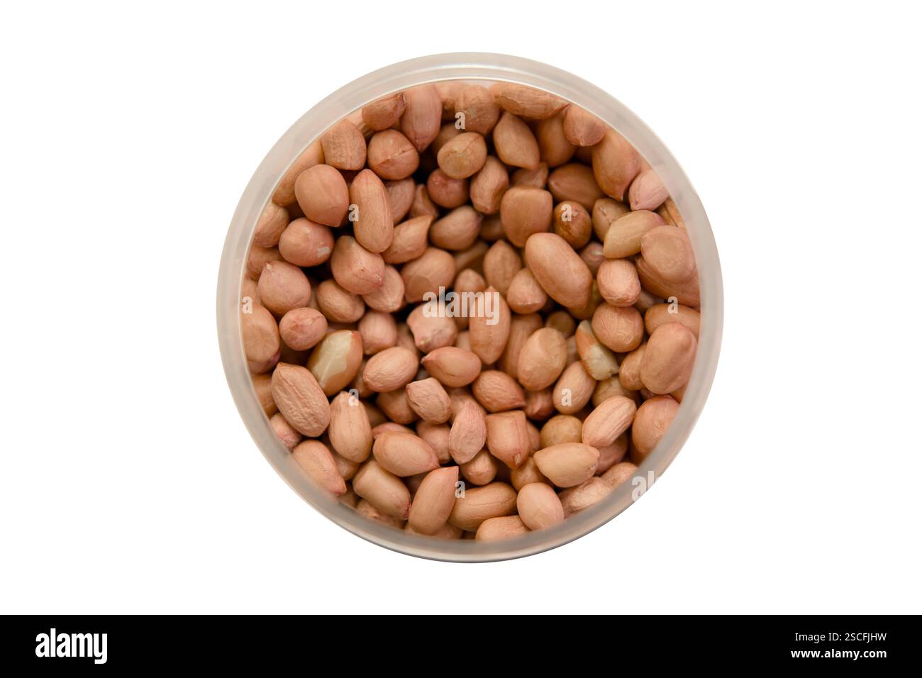 Close-up of dried peanuts in a clear container on a white background ...
