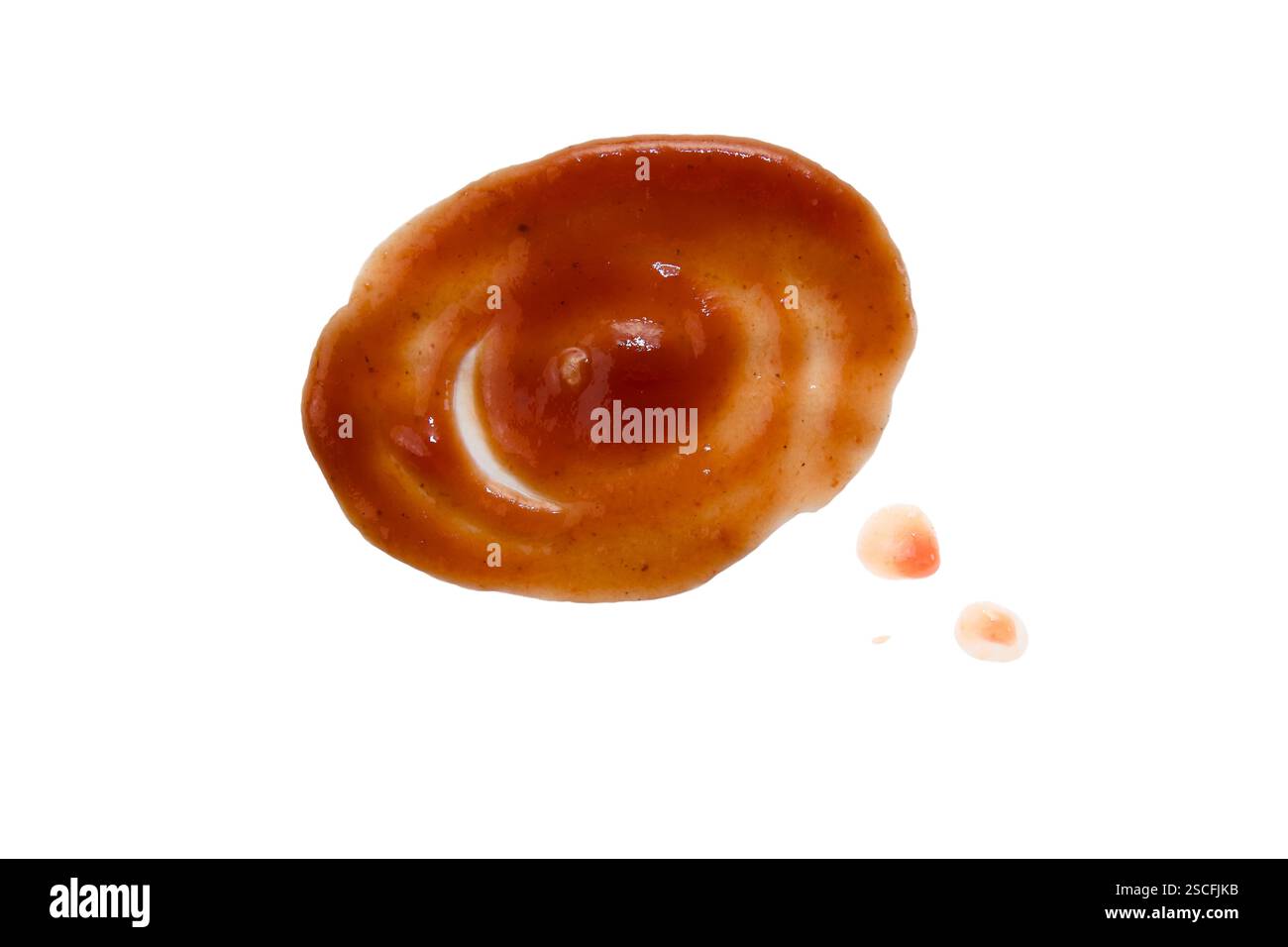 A rich brown sauce is splattered, highlighting its glossy texture on a ...
