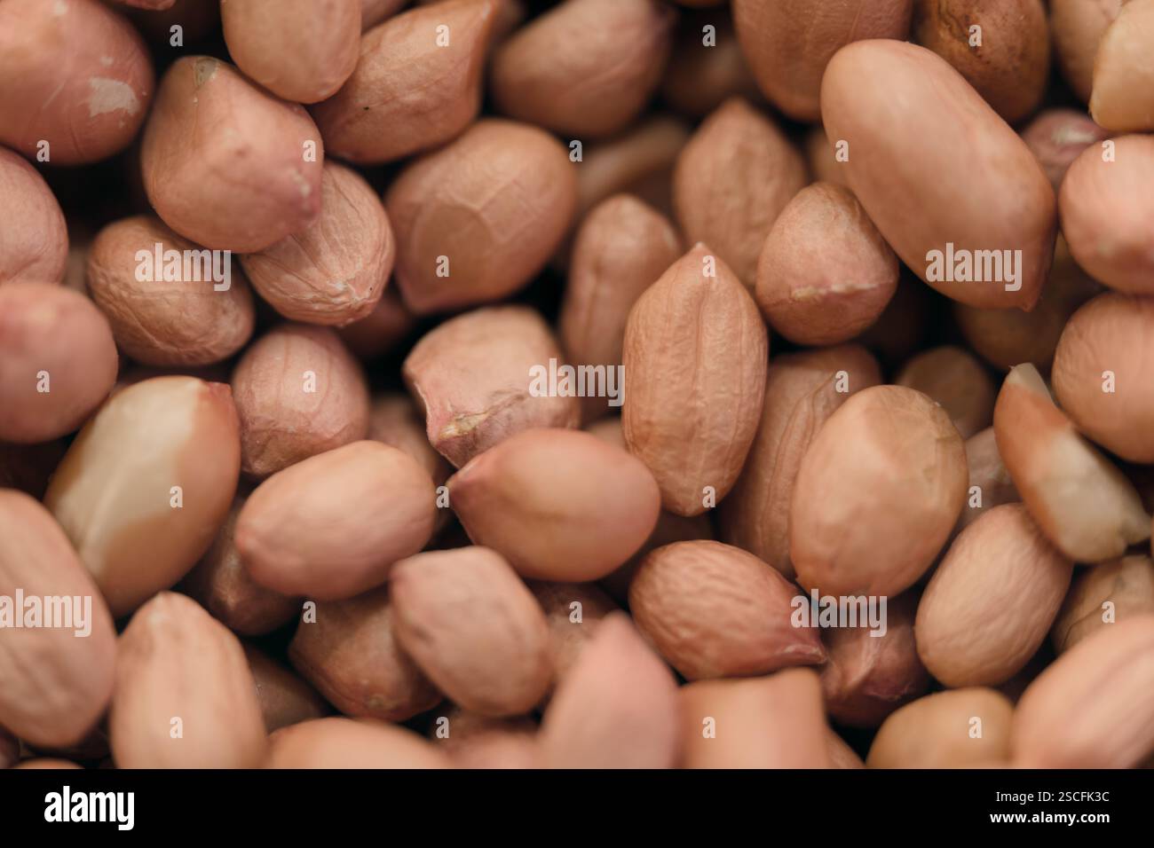 A close-up view of peanuts nestled in their shells, showcasing their ...