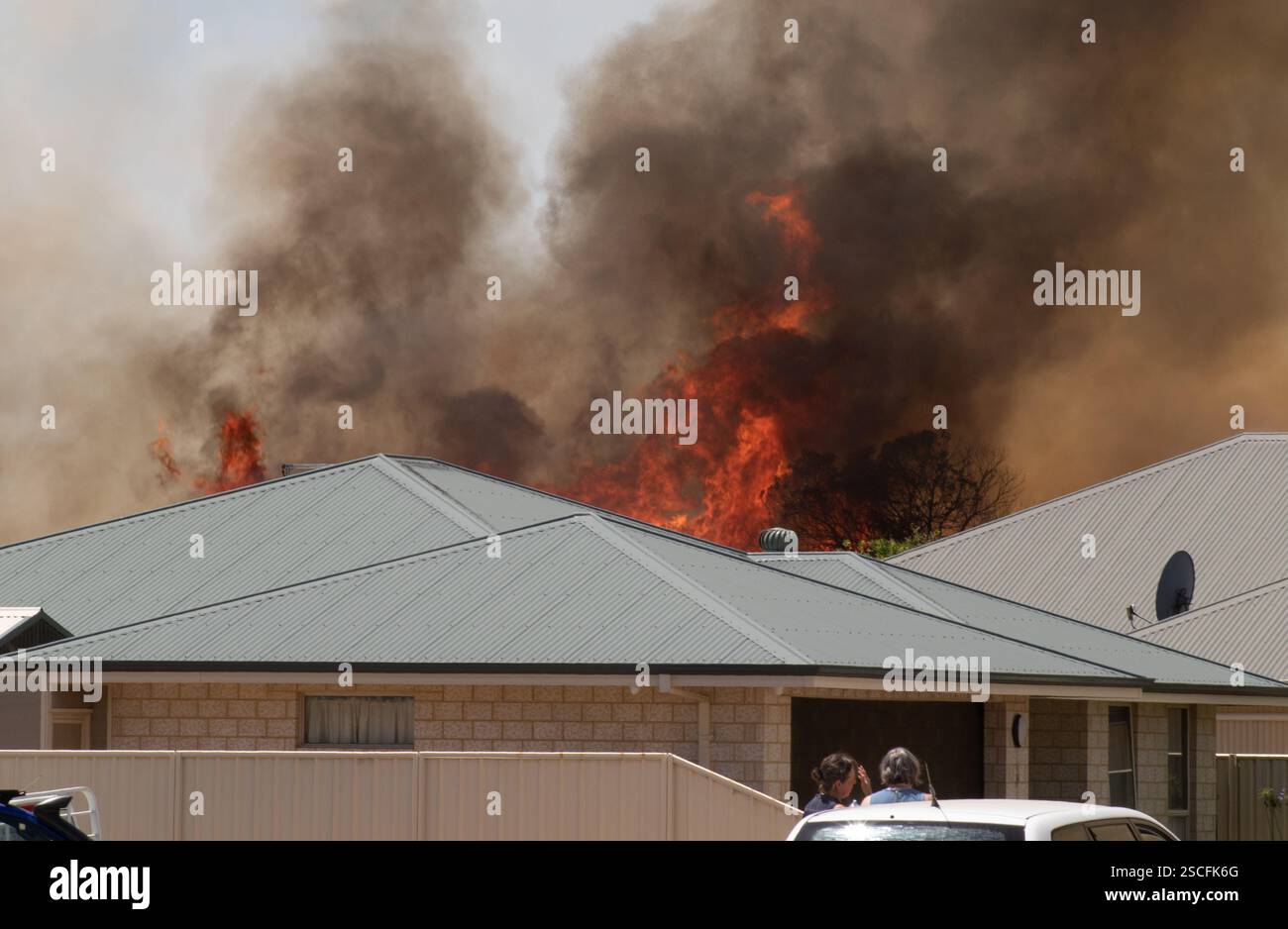 Flames and dense smoke from a bushfire close to homes in Esperance WA ...