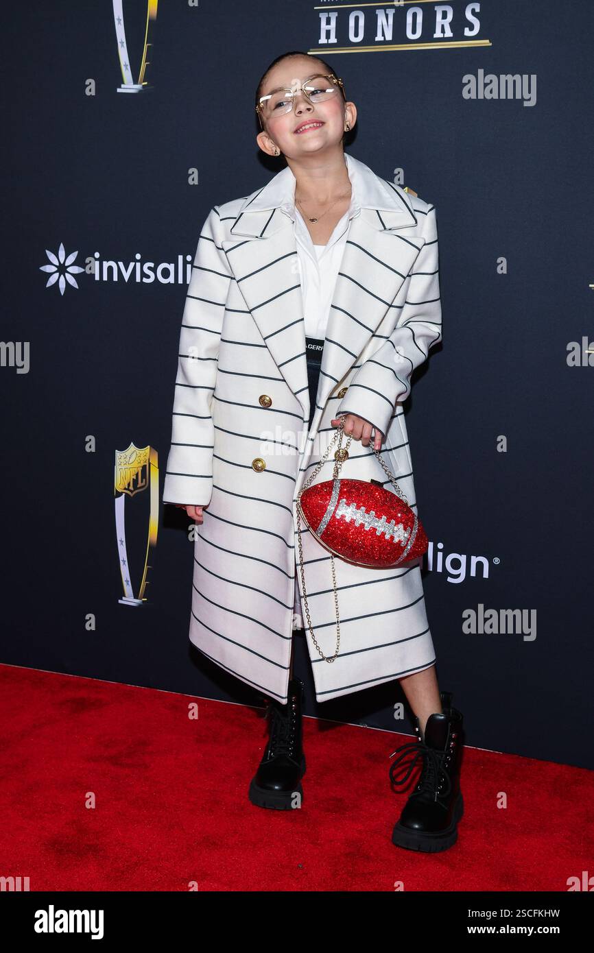 Taylen Biggs walking on the red carpet at NFL Honors at the Saenger ...