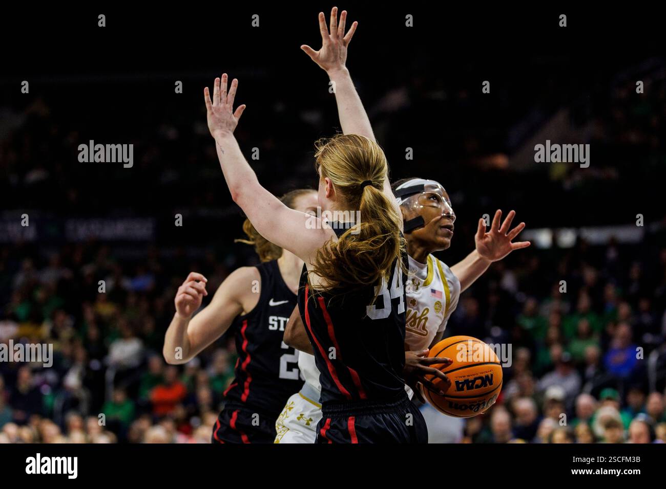 Notre Dame forward Liatu King, right, looks to shoot as Stanford guard ...