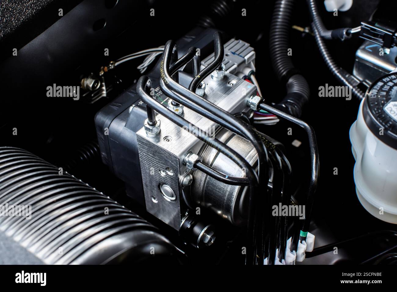 Close up of ABS module in engine bay , Anti lock brake system module of ...