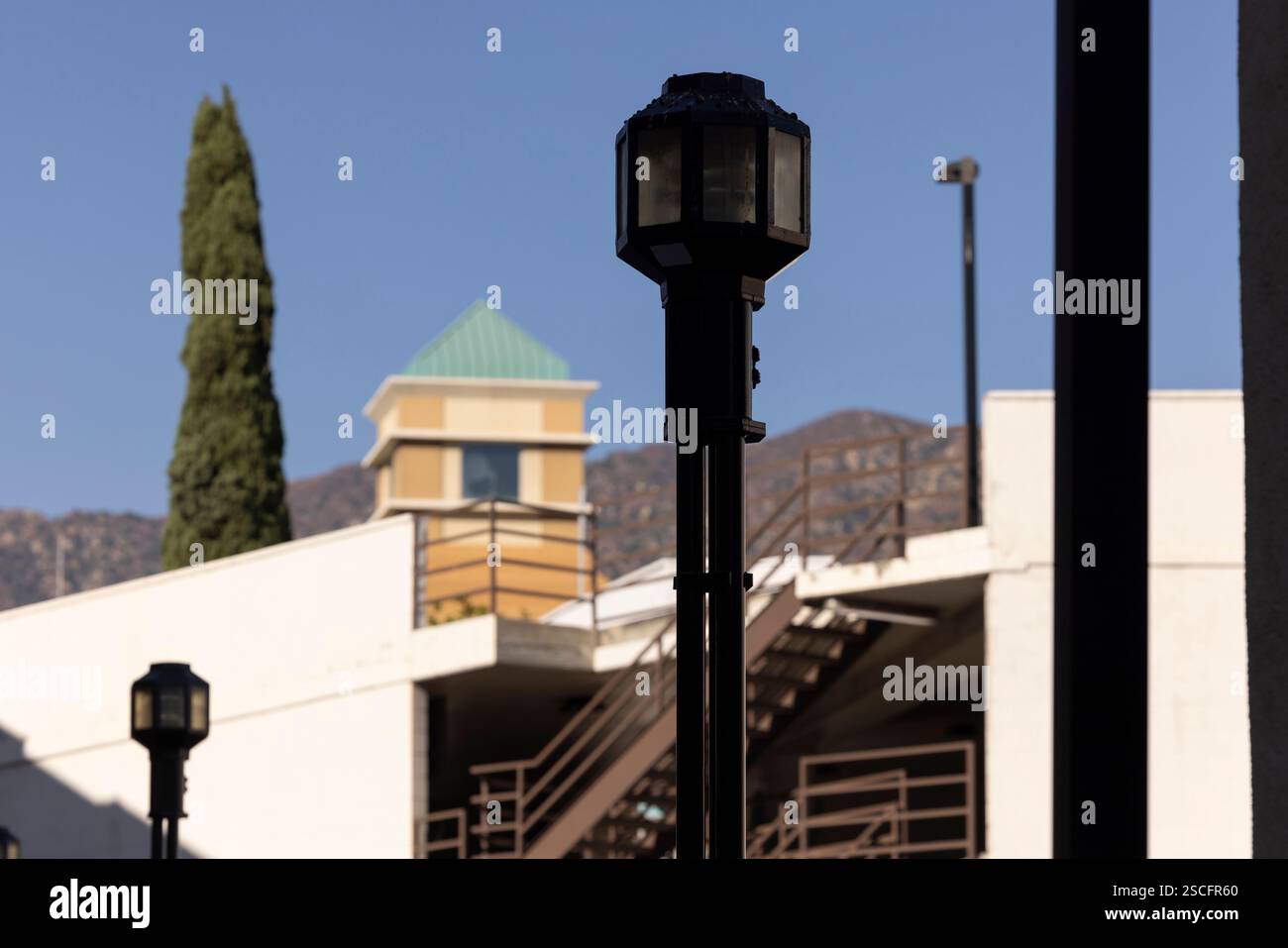 A historic street lamp frames the downtown skyline of Burbank ...