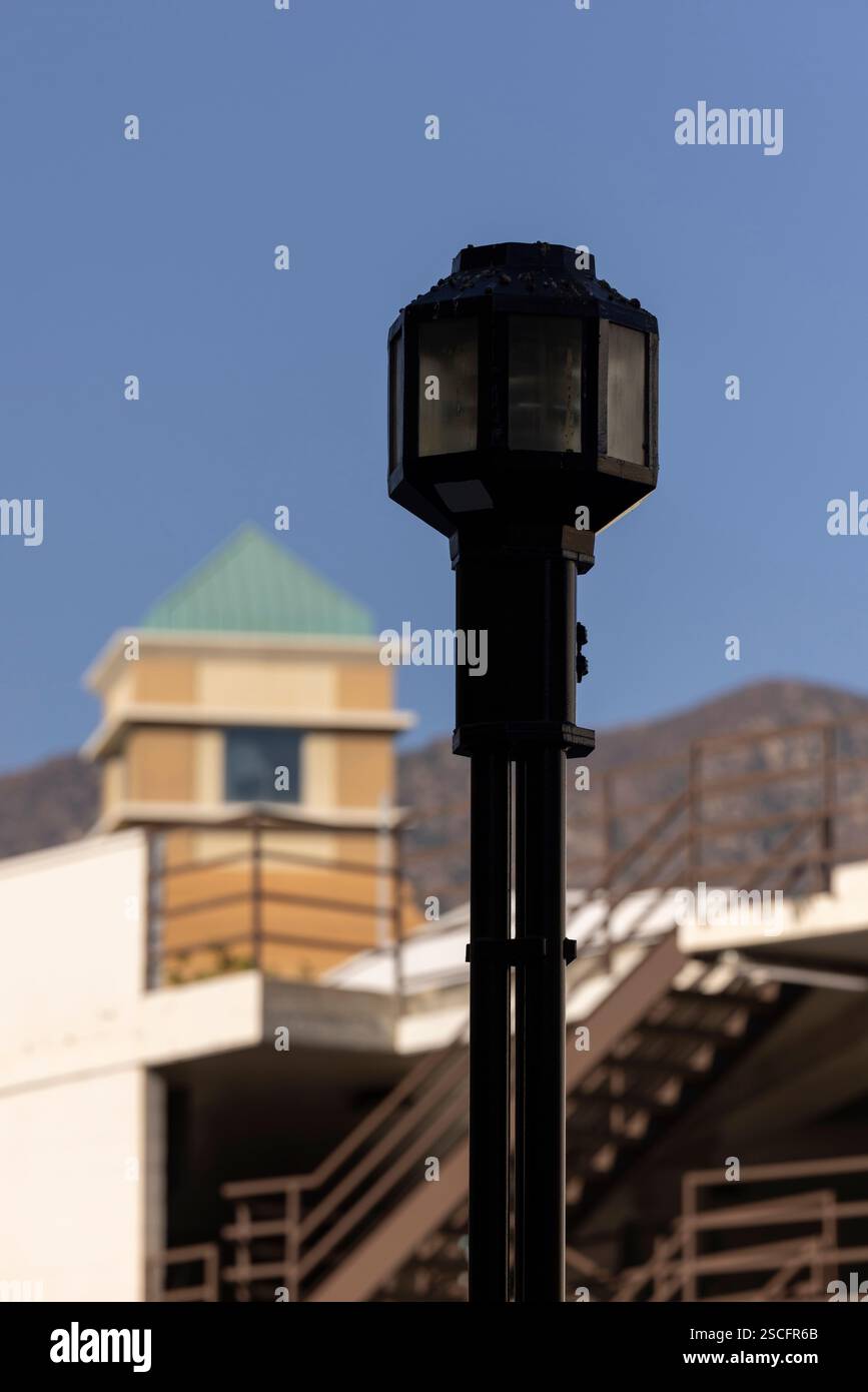 A historic street lamp frames the downtown skyline of Burbank ...
