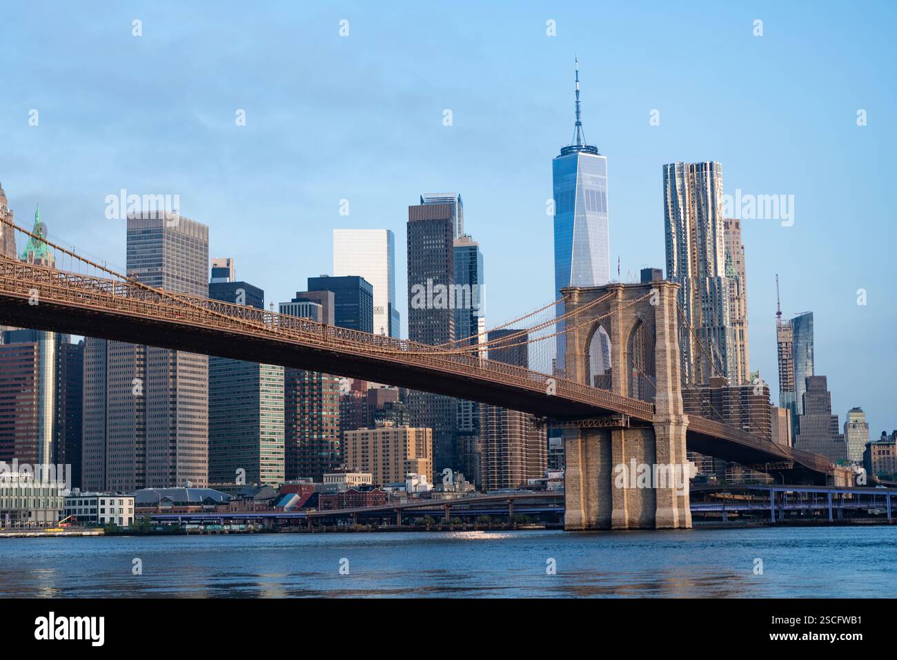 Brooklyn bridge to Manhattan. Urban architecture of New York city ...