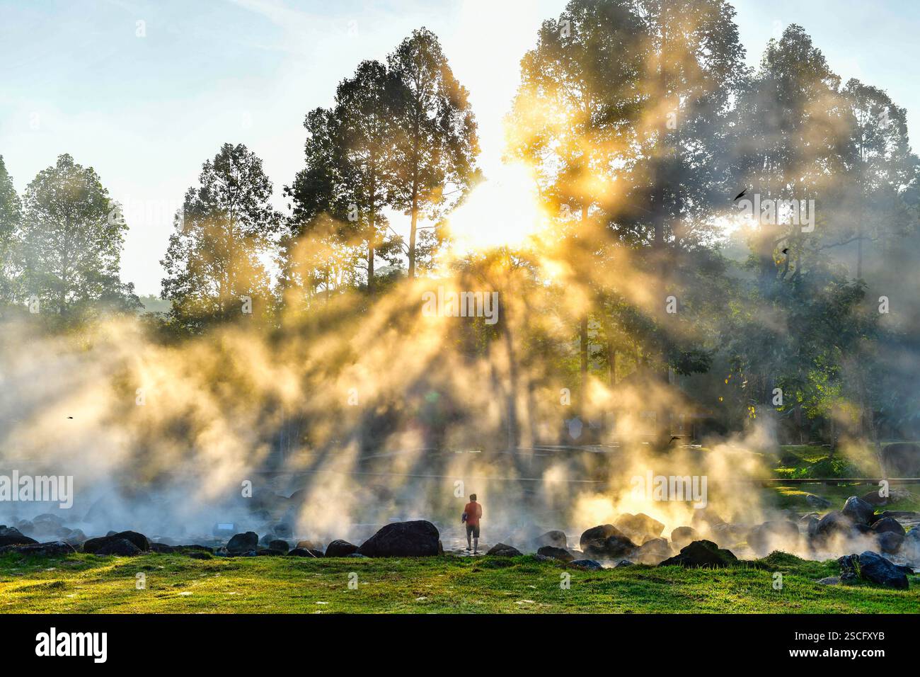 Natural hot spring with misty and morning sunrisewarm sunlight at Chae ...