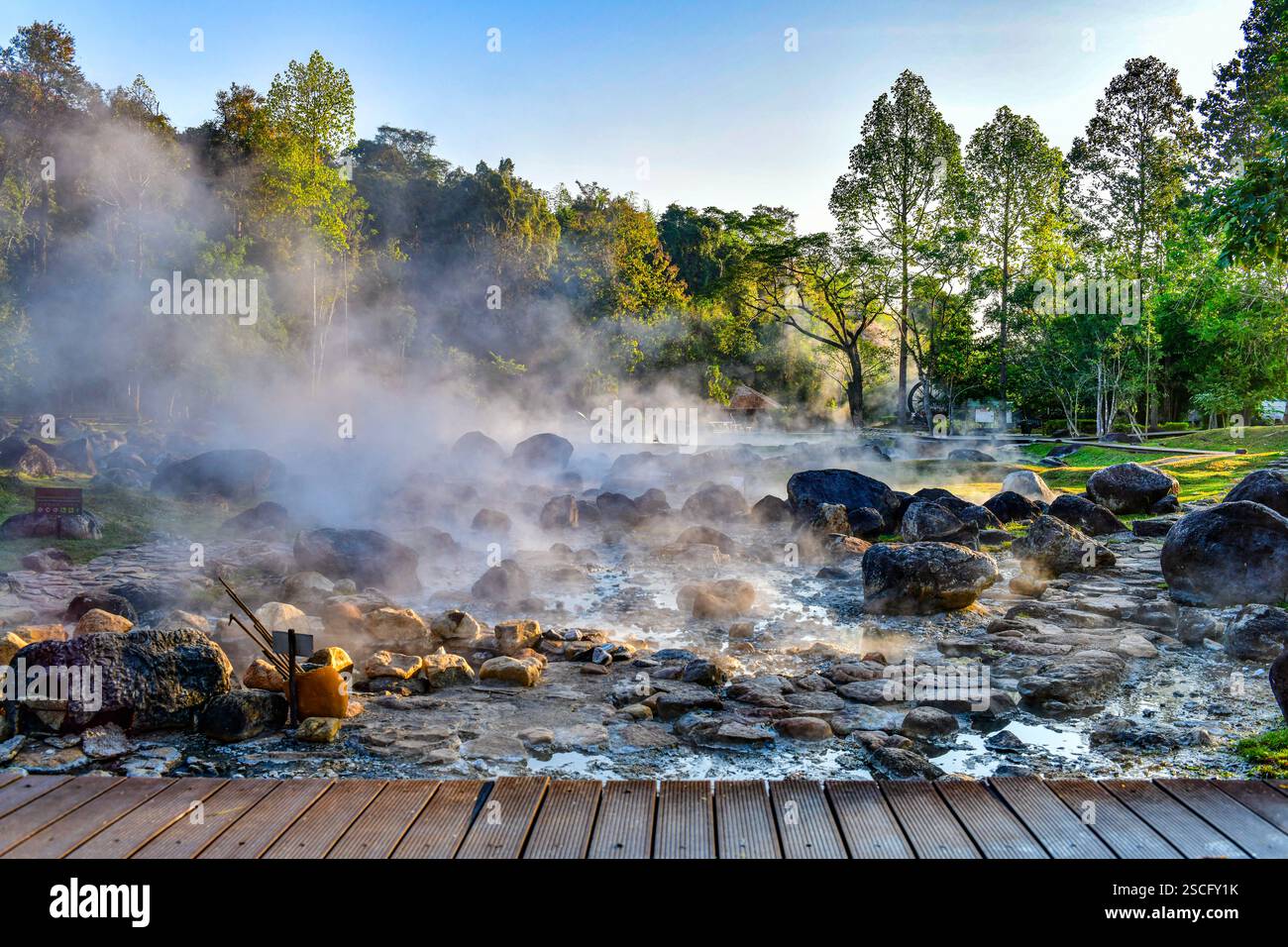 Natural hot spring with misty and morning sunrisewarm sunlight at Chae Son National Park ...