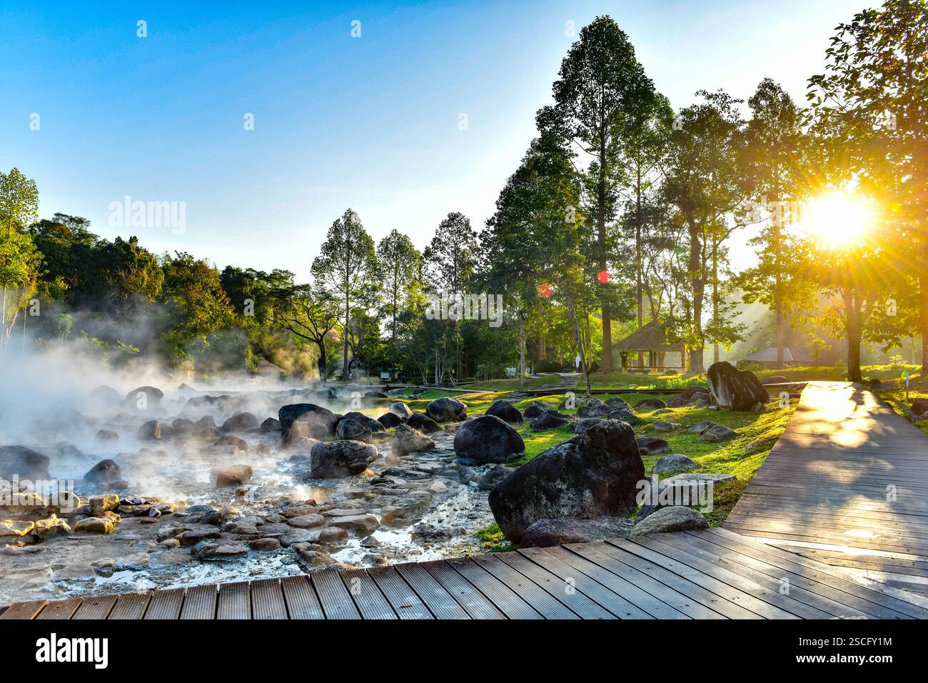 Natural hot spring with misty and morning sunrisewarm sunlight at Chae Son National Park ...